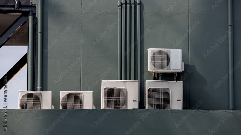 Air conditioner compressor installed in old building. Outdoor split ...