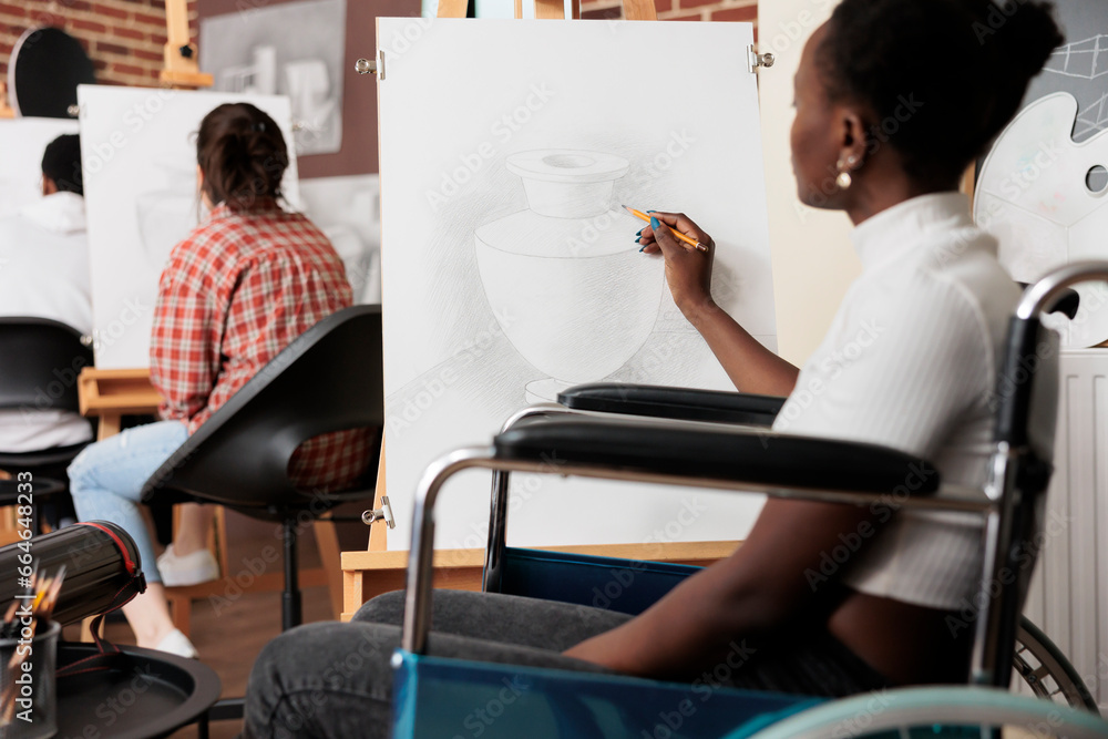 Young black woman with physical disability visiting group drawing ...