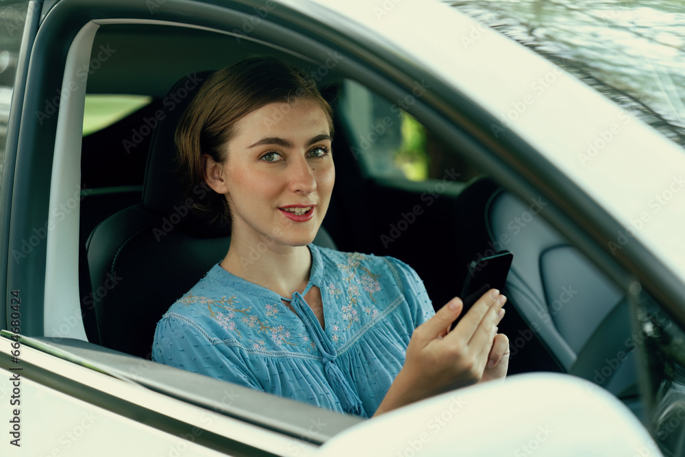 Beautiful woman in casual wear sitting on driver seat portrait. Cute ...