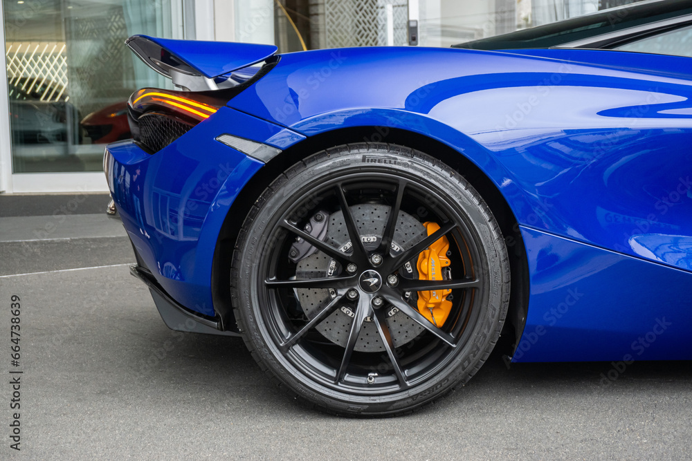 Blue McLaren 720s rear end side view, wheel focused shot Stock Photo ...