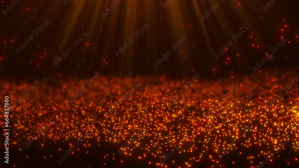 Abstract golden glowing particles rise up and are illuminated by bright ...