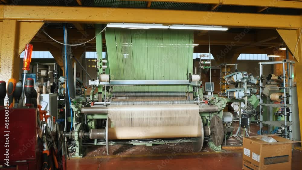 weaving looms. weaving factory. textile industry. Automated weaving ...