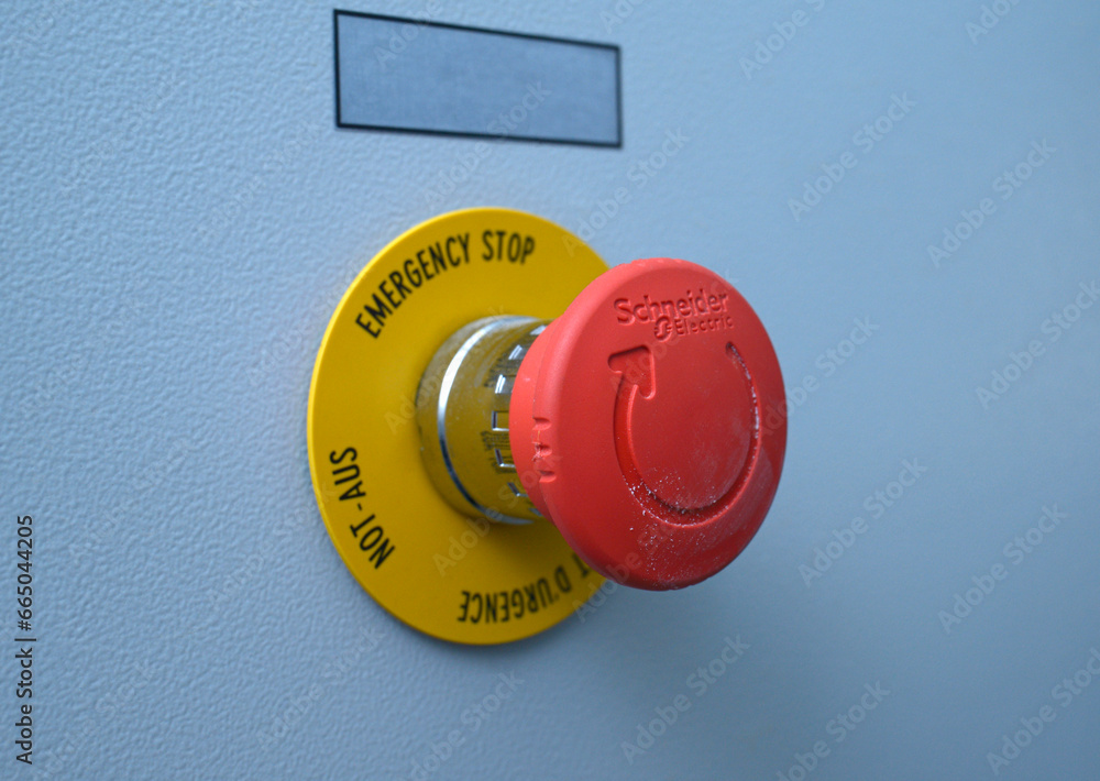 Red emergency stop button, part of a control panel equipment by ...