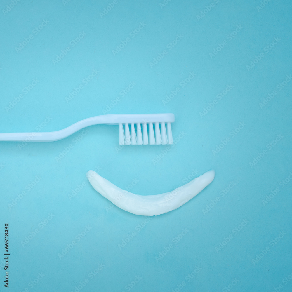 Smiley face created from paste with white Toothbrush. Care for oral and ...
