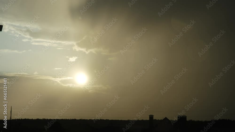 Border of rain storm front and clear sky with sun from window of ...