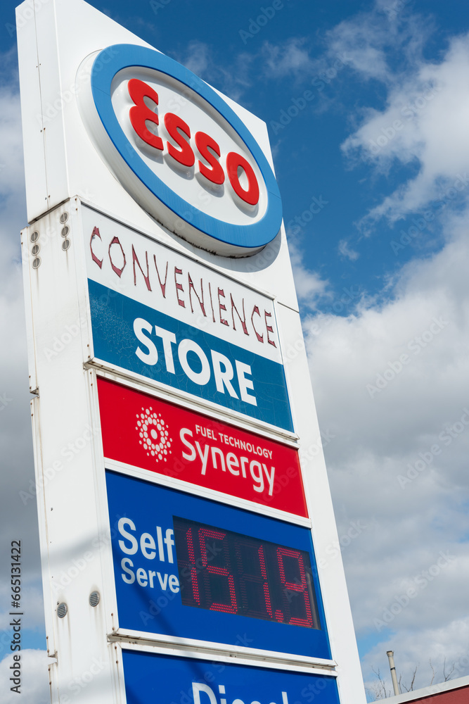 exterior pylon sign and other signage of Esso gas station, located at ...