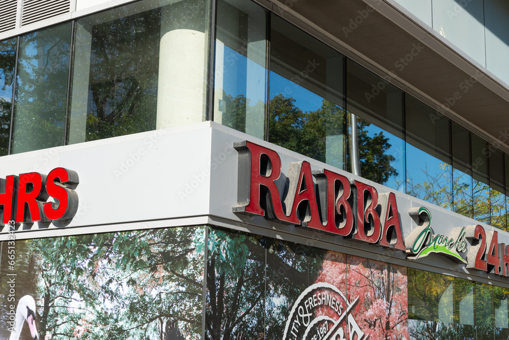 corner building facade and sign of Rabba Fine Food, a grocery store ...