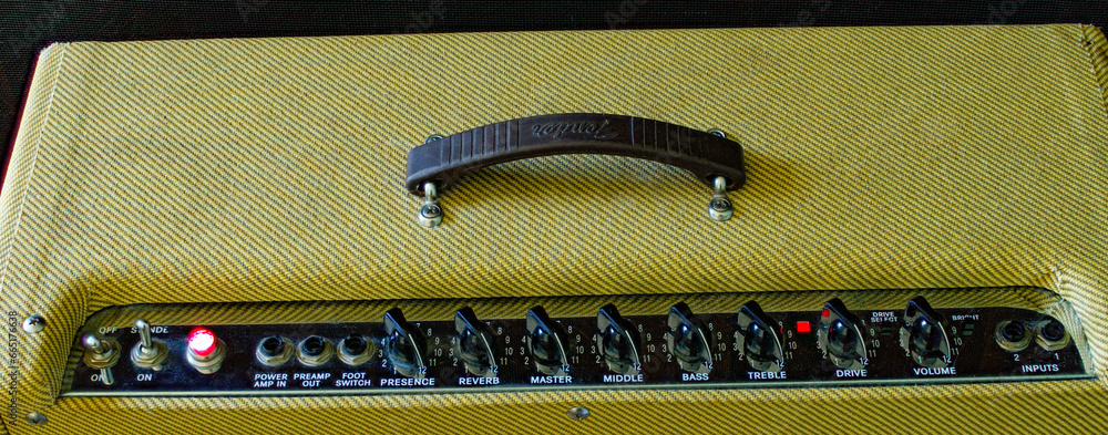 Old vintage retro style guitar tube amp or amplifier yellow tweed ...