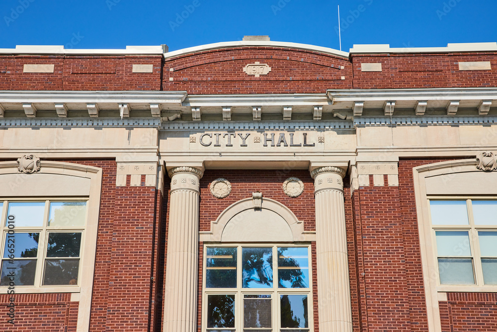 City hall sign on concrete portion of red brick building Stock Photo ...