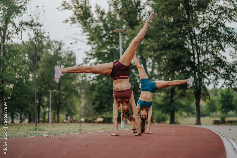 Fotka „Girls inspire with their athletic bodies, performing 360-degree ...