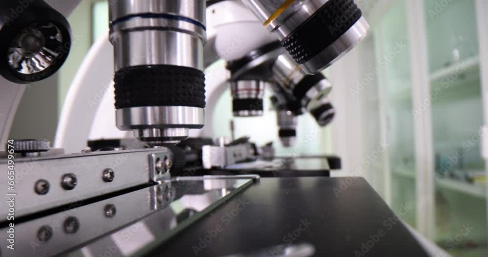 Professional microscopes with lenses in row at technology exhibition ...