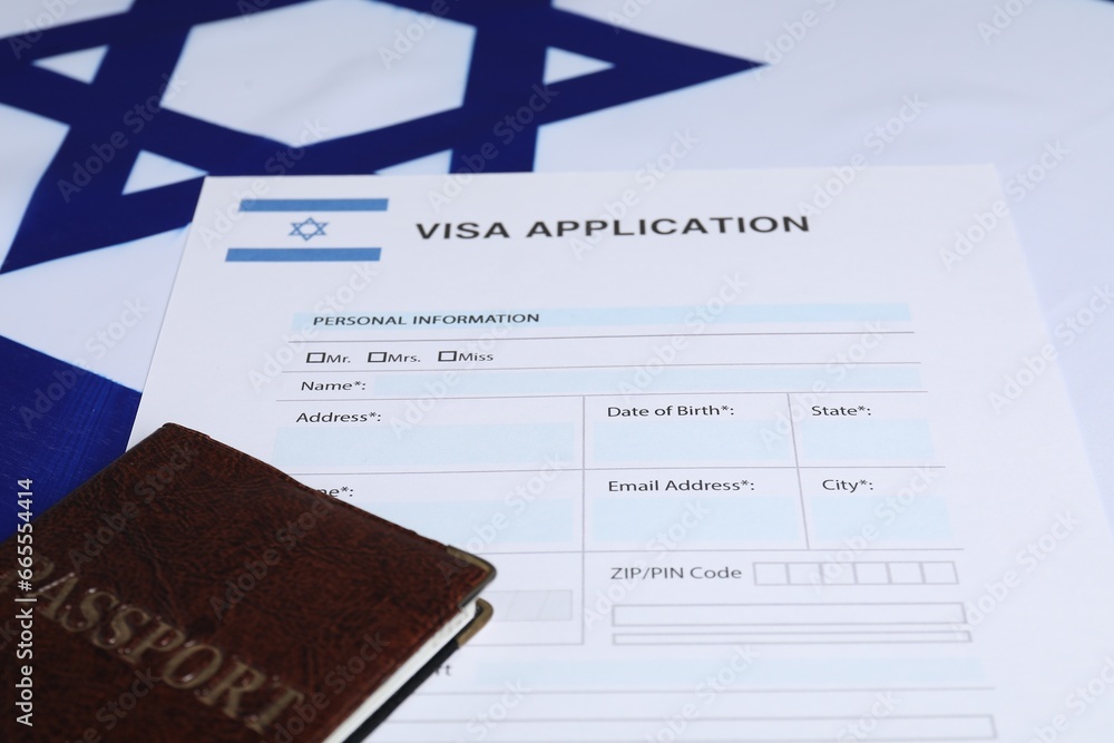 Immigration to Israel. Visa application form and passport on flag ...