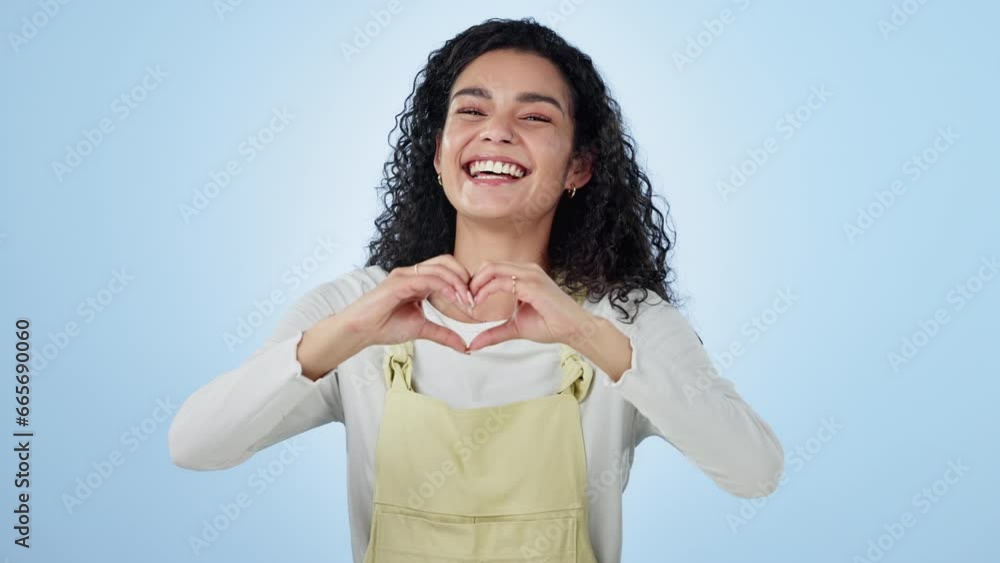 Heart, hands and face of woman in studio for kindness, happy icon and ...