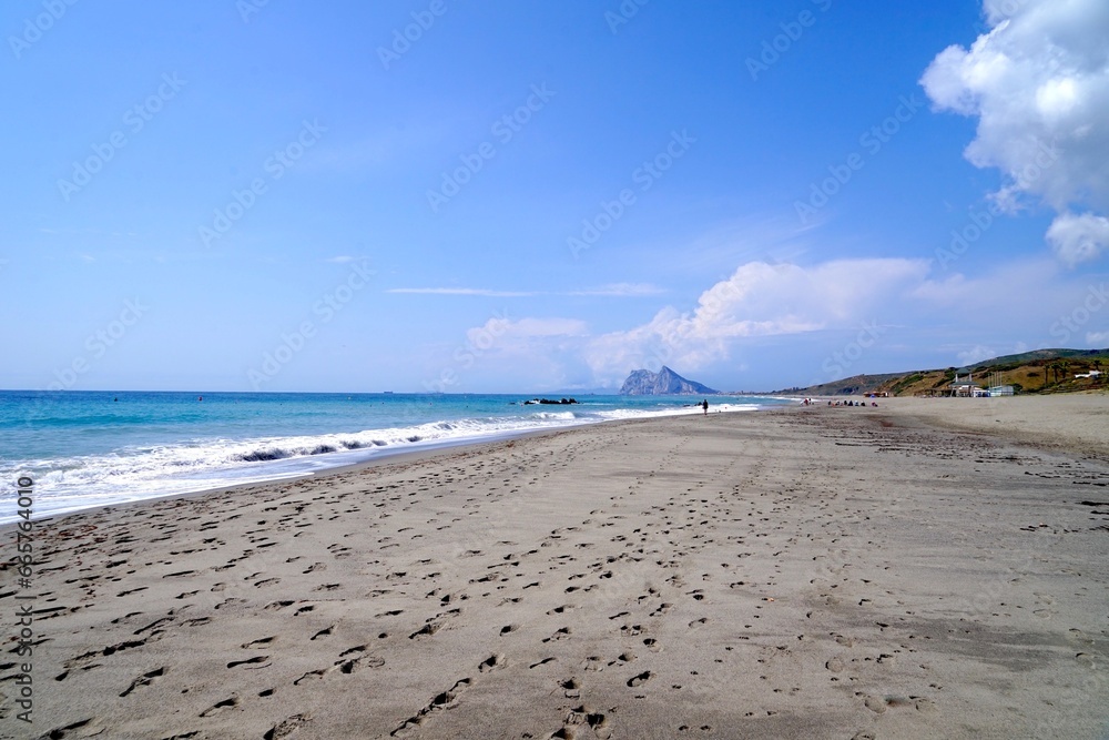sandy beach in La Alcaidesa with the Rock of Gibraltar in the ...