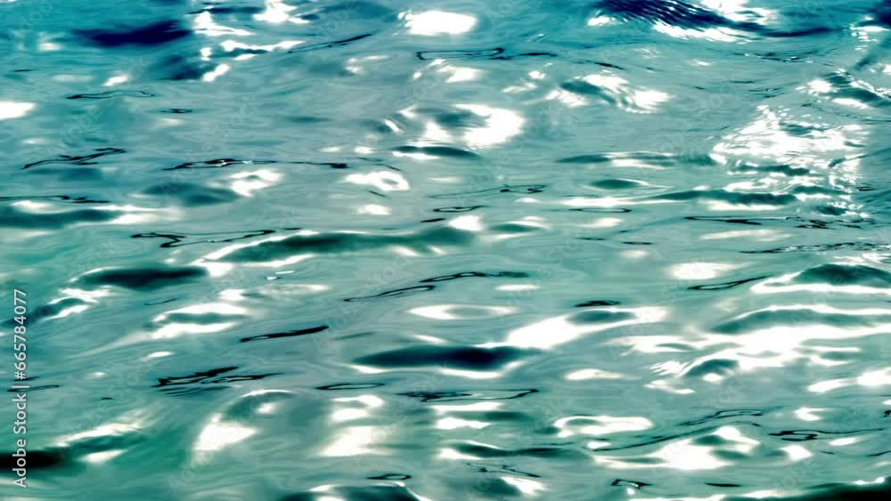 smooth flowing water wave of a river with sunlight on water surface ...