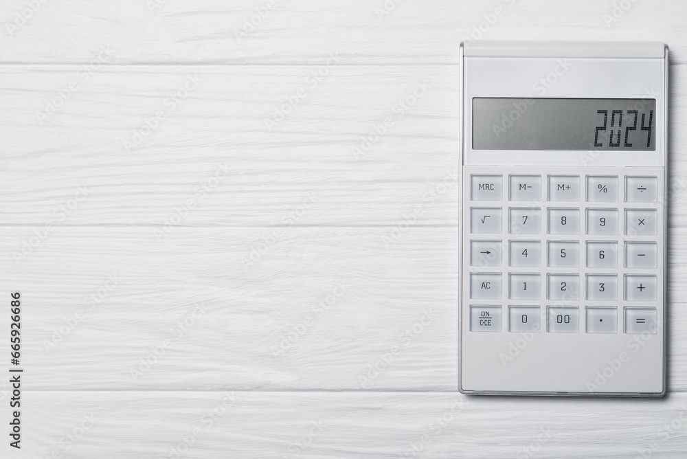 2024 on calculator screen. New year 2024 on the calculator display ...