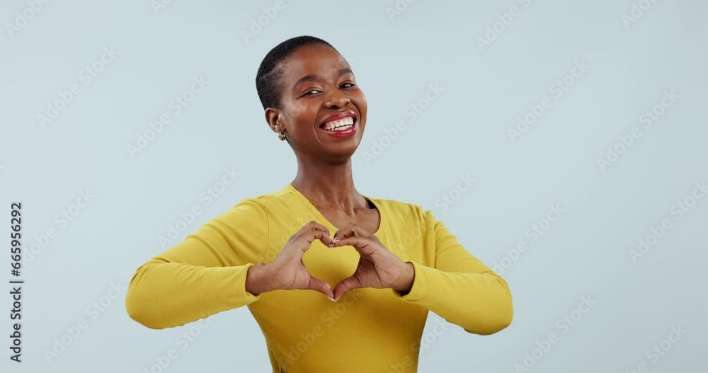 Heart, hands and face of black woman in studio for kindness, wellness ...