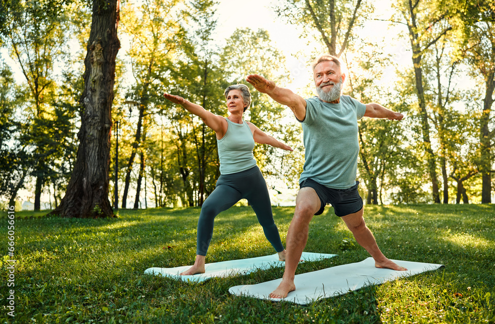 Active retirement life. Determined family couple standing on rubber ...