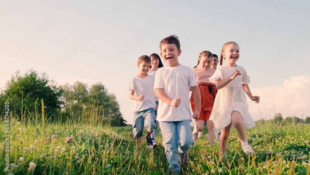 Family mom dad kids, weekend outdoors. Children, parents run in park ...