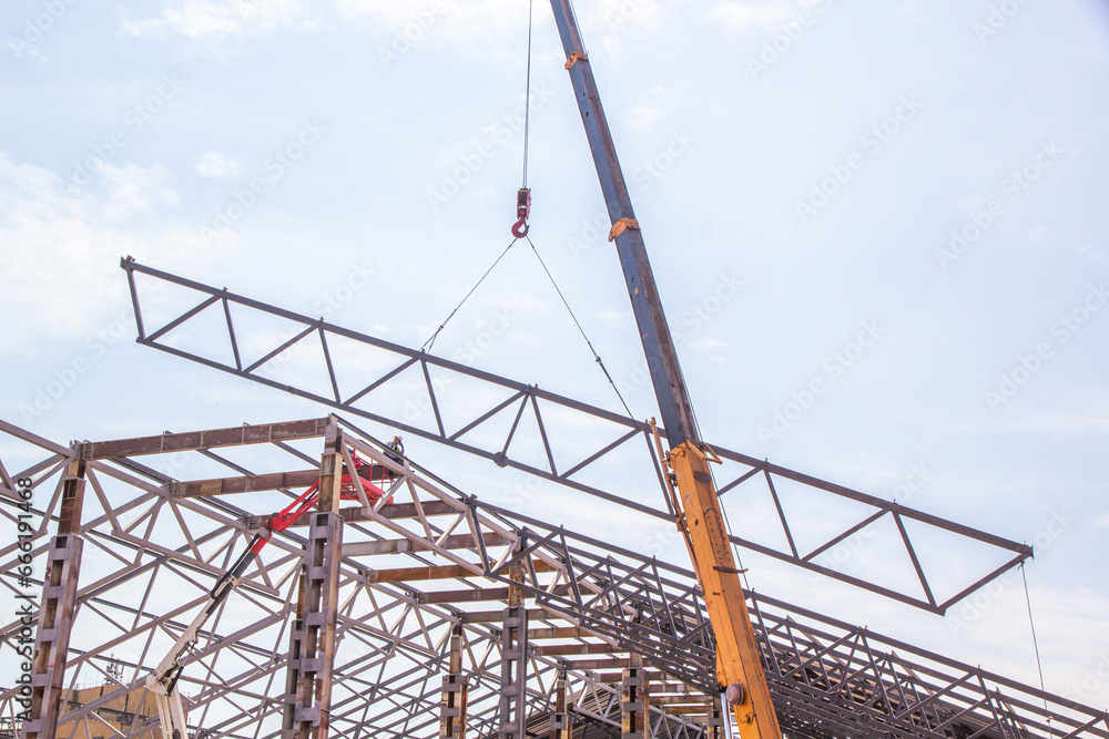 Installation of metal rafter trusses of the covered warehouse with a ...