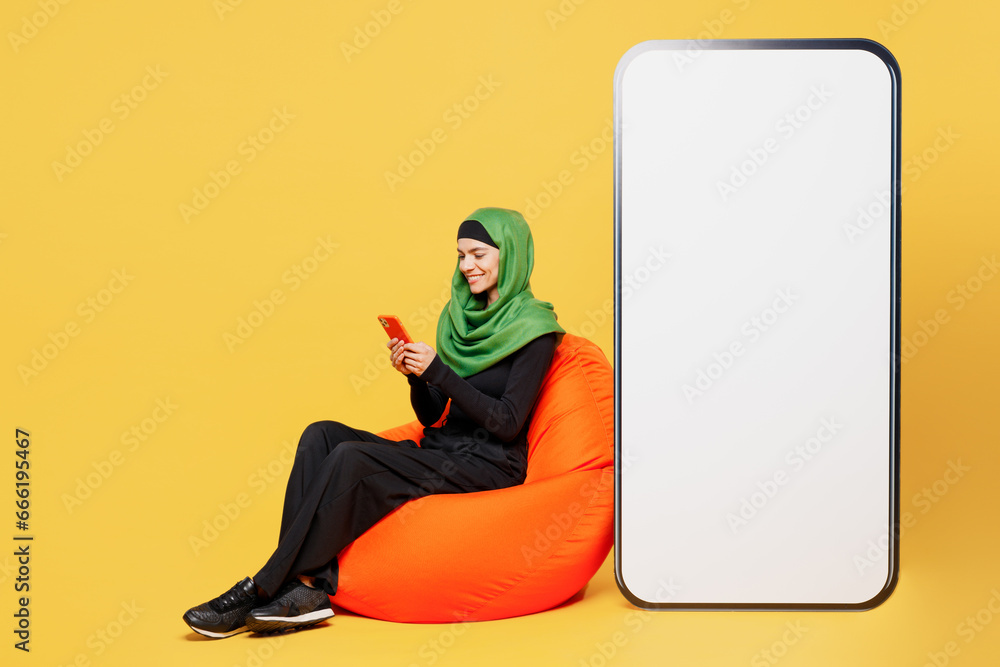Full body young asian muslim woman wear green hijab abaya black clothes ...