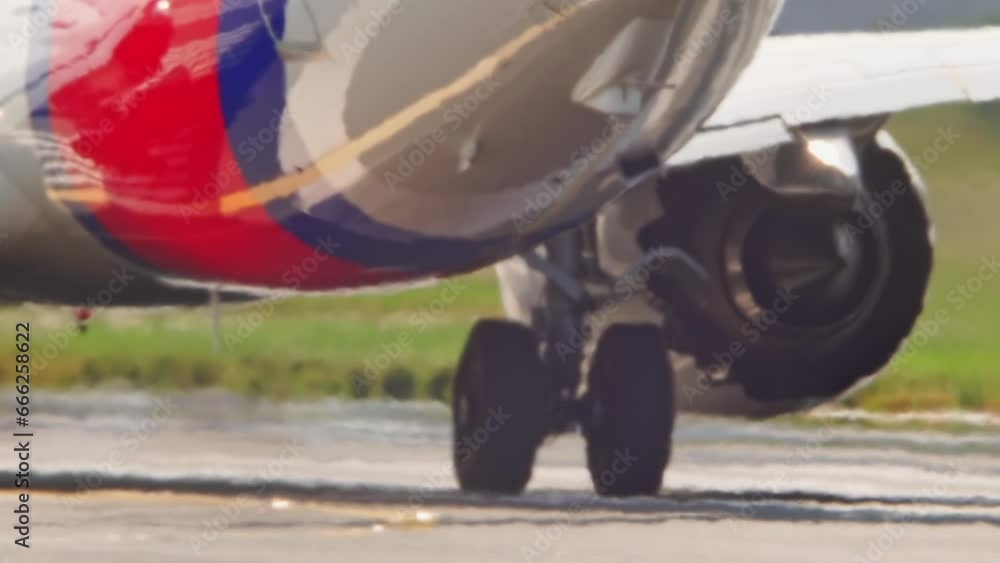 Close up at working engine jet of the airplane before taking off at hot ...