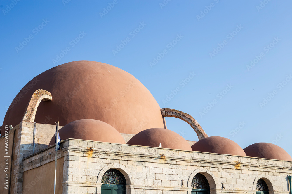 Brown mosque with brown domes detail architecture in Chania, Crete ...