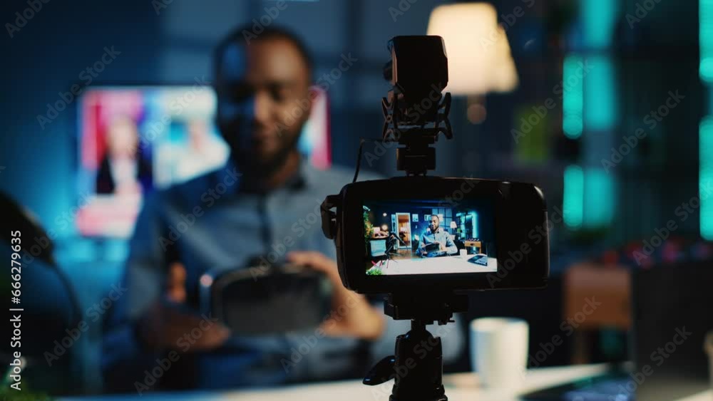 Tech content creator filming technology review of newly released gaming ...