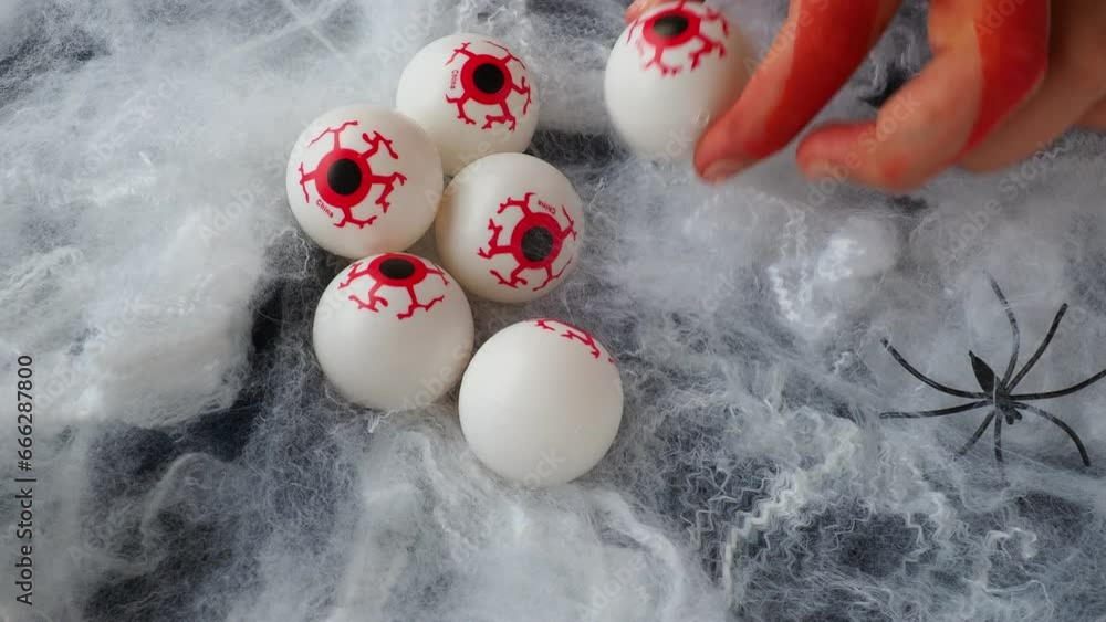 The monster's bloody hand with peeling skin collects, rearranges and ...