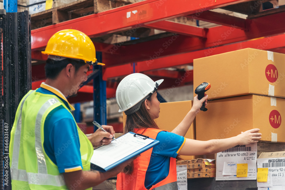 Warehouse management team use bar code scaner scan goods shelf writing ...