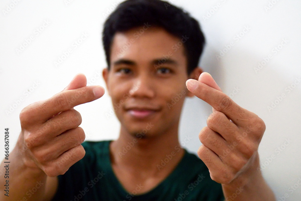 Hand gesture with crossed index finger and thumb symbol Saranghae ...