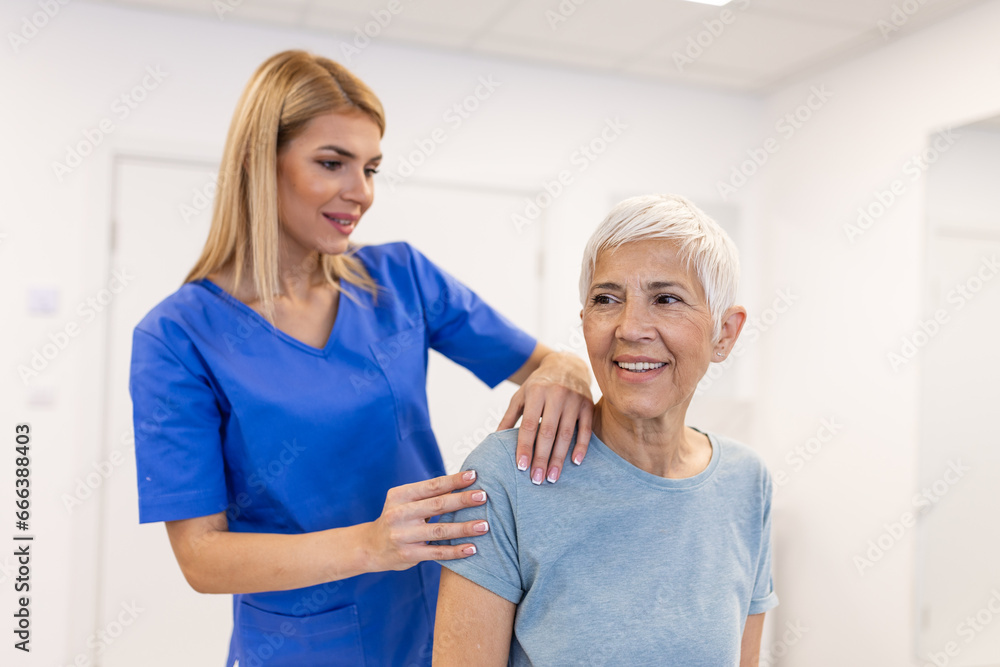 Woman Doctor Osteopath In Medical Uniform Fixing Senior Woman Patients