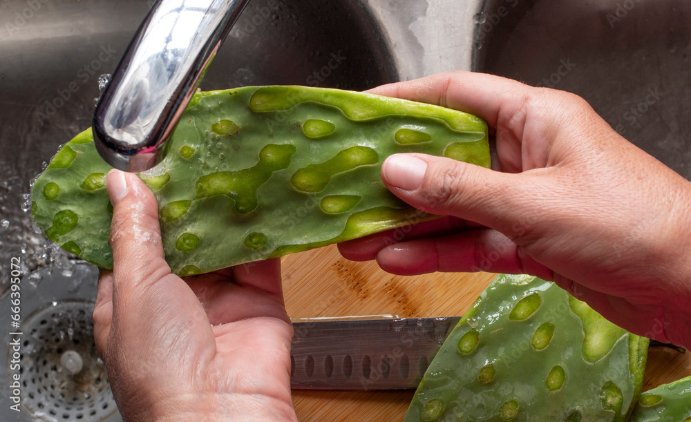 Concept of grabbing food or food handling, woman's hands washing a ...