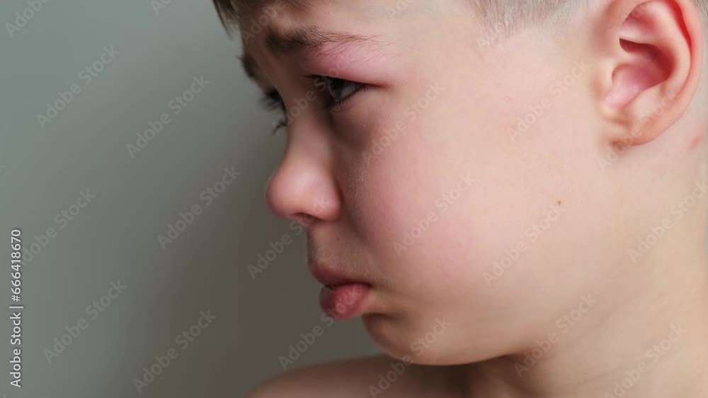 Dramatic portrait of a crying 7 year old boy. Tears flow from the eyes ...