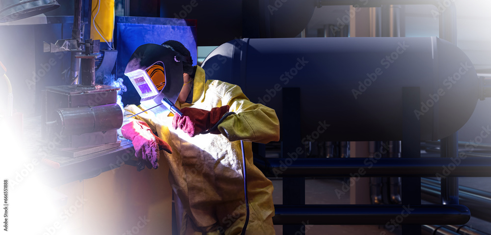 Man welder. Worker uses soldering machine. Human works as welder at ...