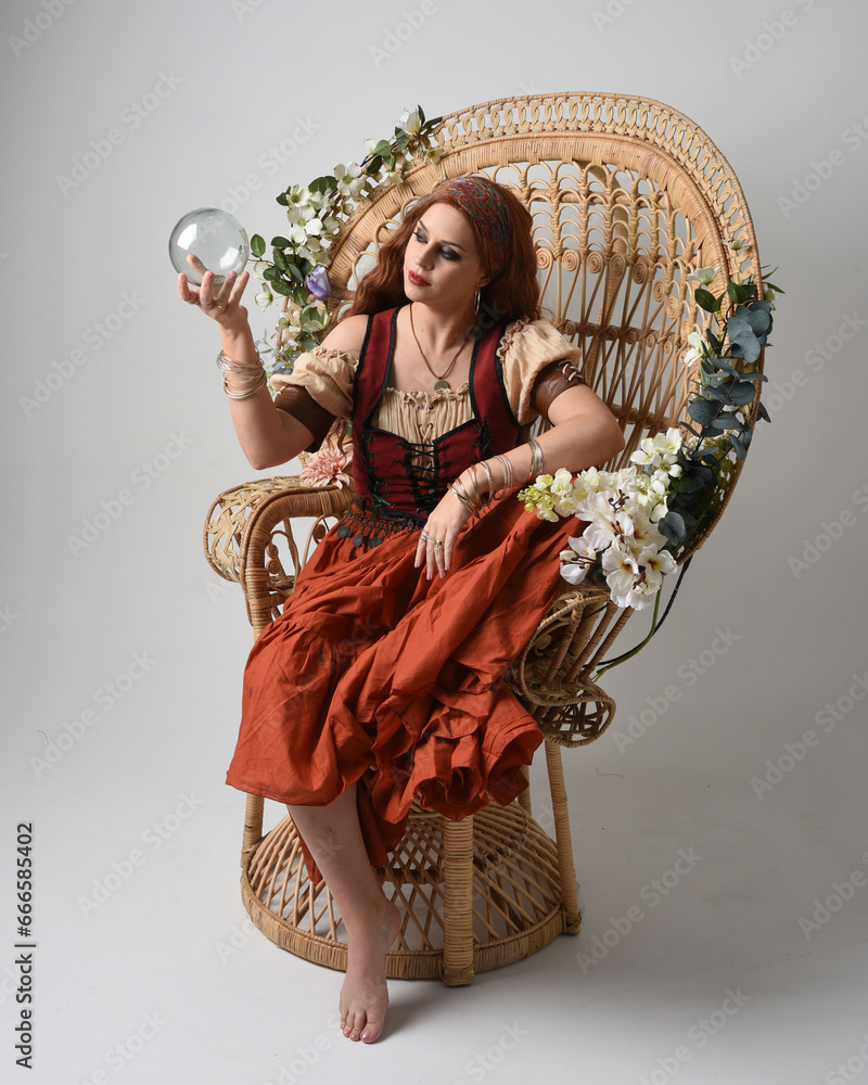 Full length portrait of beautiful red haired woman wearing a medieval ...