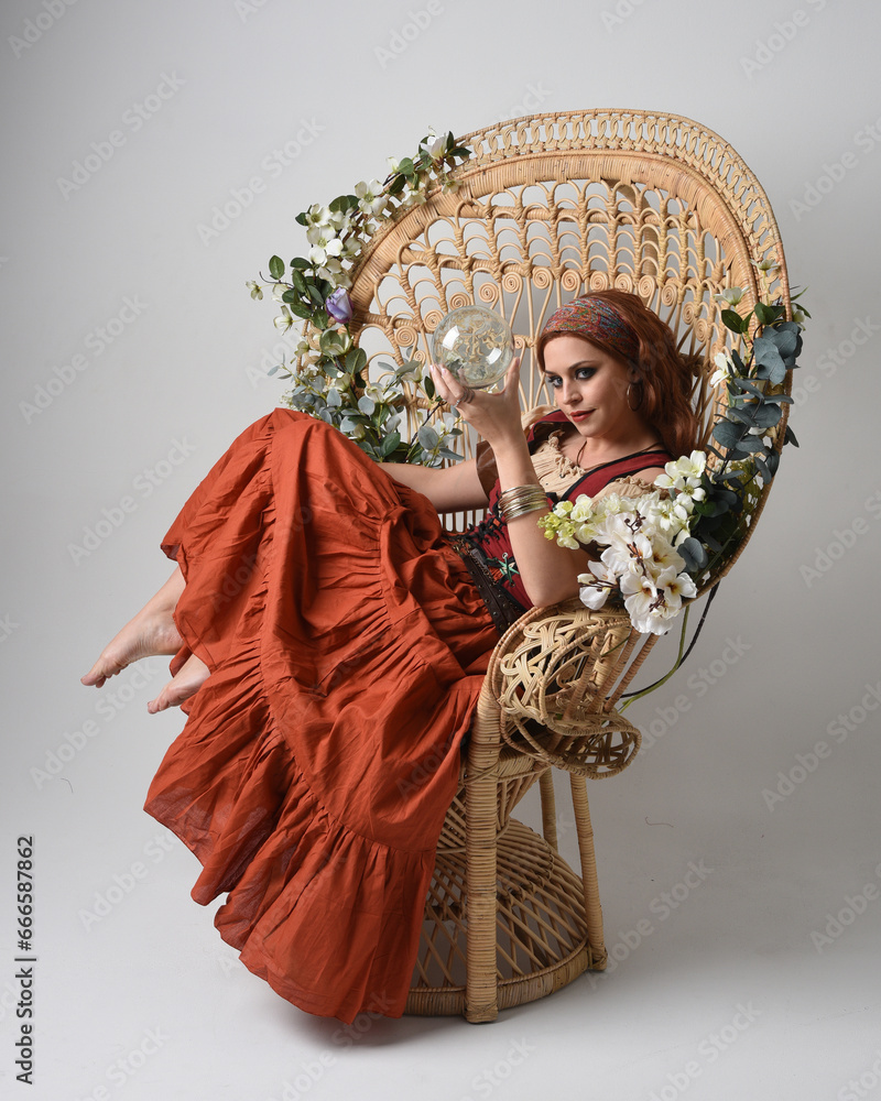 Full length portrait of beautiful red haired woman wearing a medieval ...