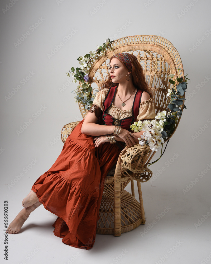Full length portrait of beautiful red haired woman wearing a medieval ...