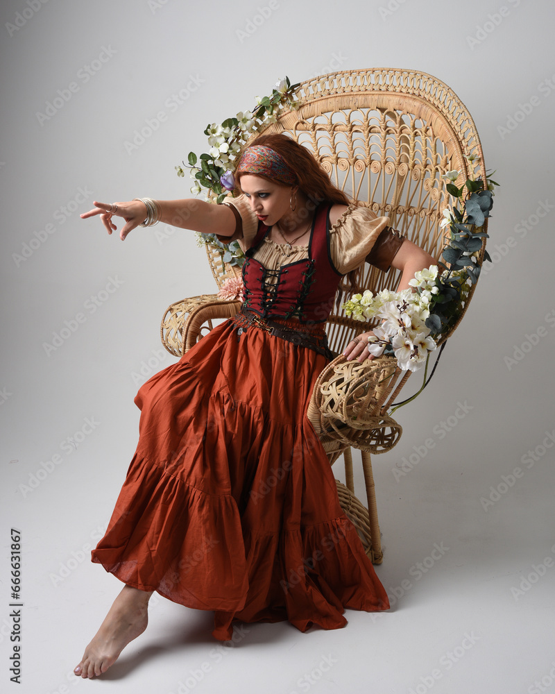 Full length portrait of beautiful red haired woman wearing a medieval ...