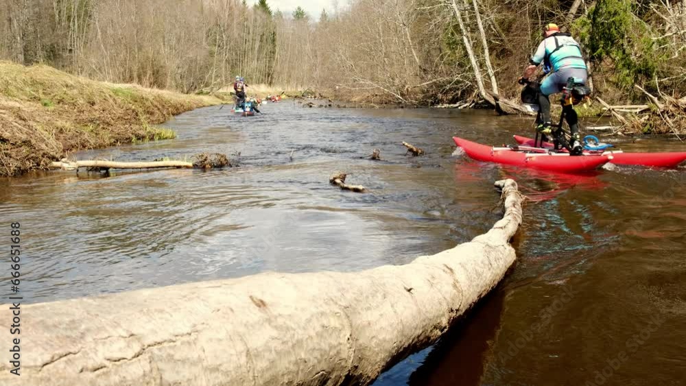 Canoeing, a type of rowing sport, follow of dual kayak going down the ...