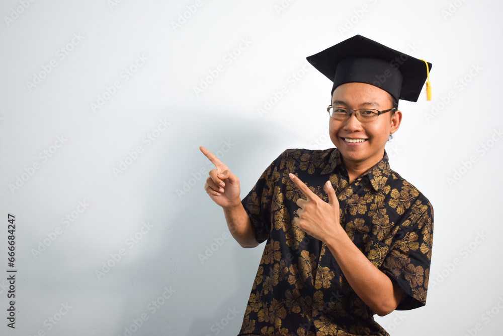 Expressive of Adult indonesia male wear batik, toga cup or graduation ...