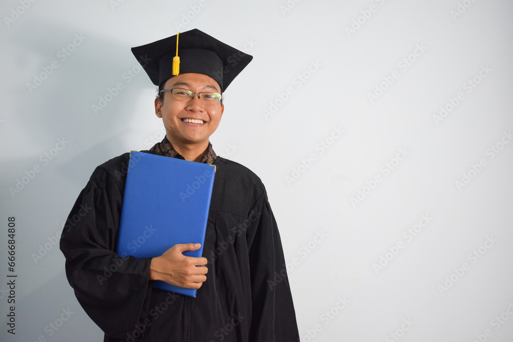 Expressive of Adult indonesia male wear graduation robe, hat and ...