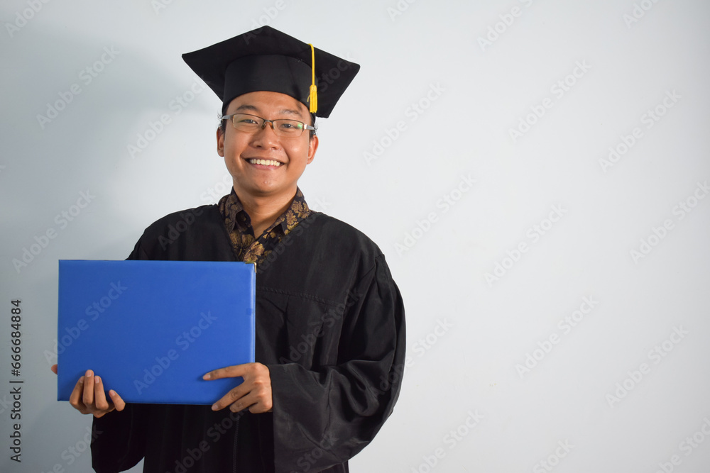 Expressive of Adult indonesia male wear graduation robe, hat and ...
