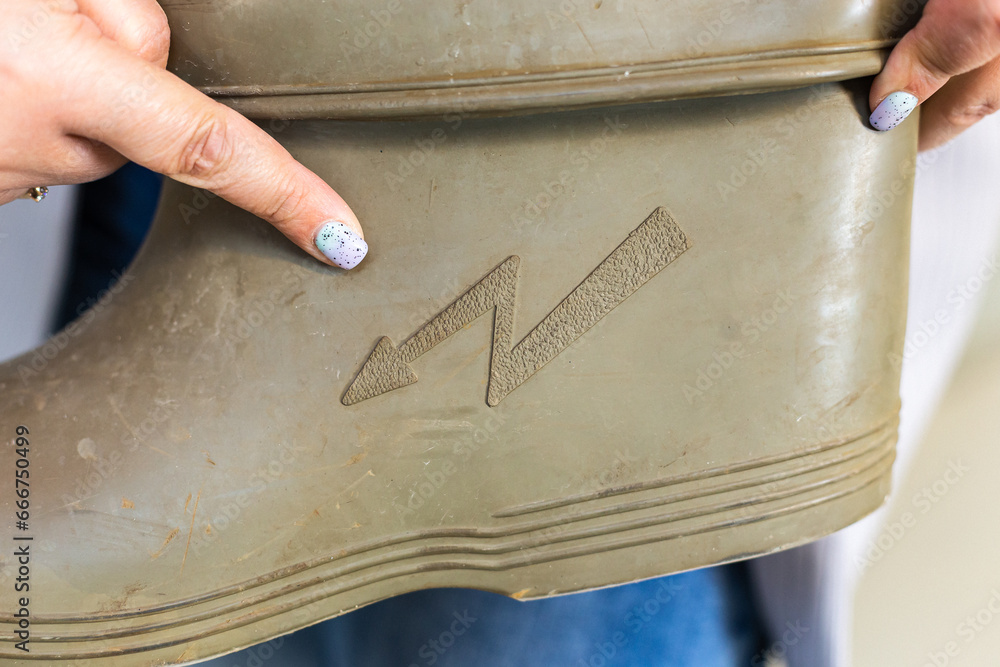 Special dielectric rubber boots and gloves designed to work with high ...