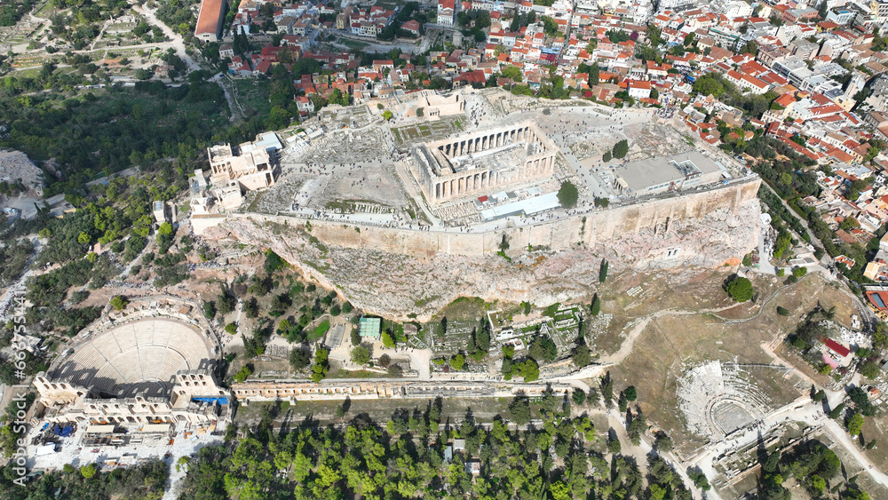 Aerial drone cinematic shot above unique Acropolis hill, the Parthenon, Odeon of Herodus Atticus ...