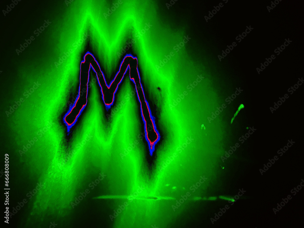 Glowing English letter M. A letter of the English alphabet is ...