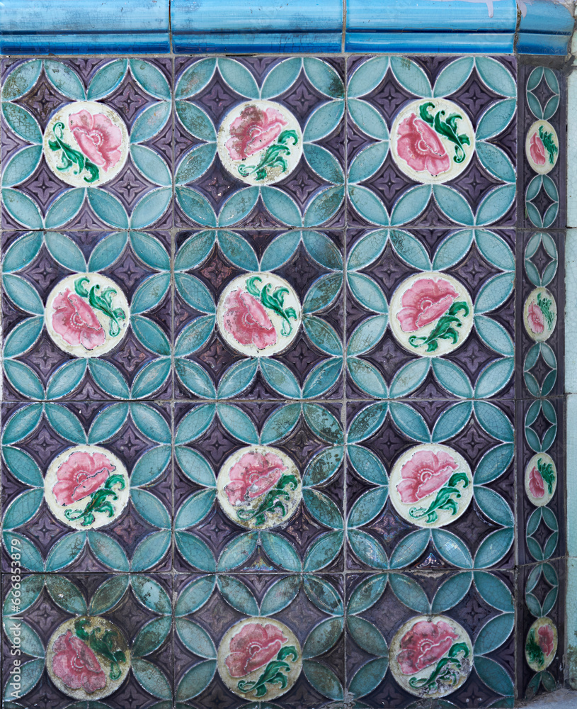 Rows of antique Nyonya Tiles with pink flowers with green background ...