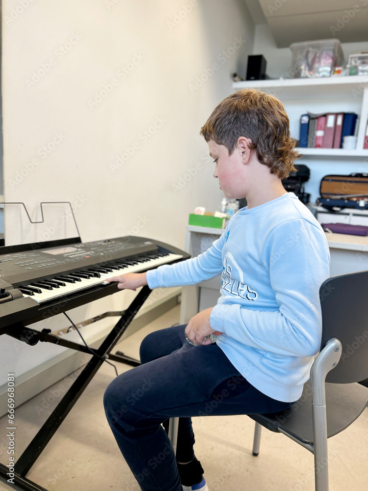 boy playing piano, music therapy for children with autism Stock Photo ...