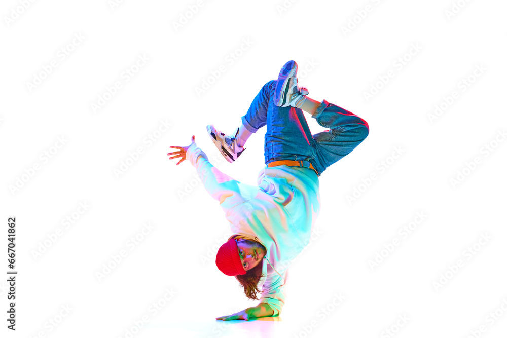 Flexible yo9ung man in sport clothes dancing hip hop, breakdance ...