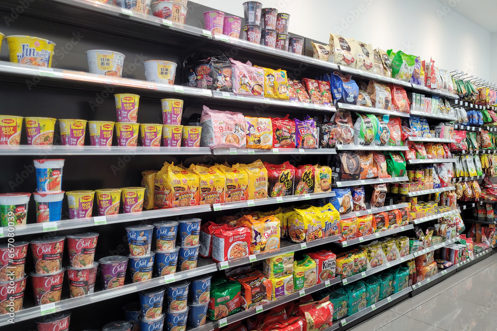 PENANG, MALAYSIA - 7 OCT 2023: A wide selection of convenience foods is ...